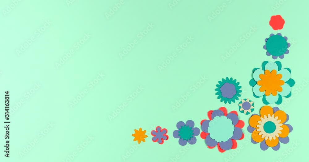 Animated stop motion background frame of blooming paper flowers on a ...