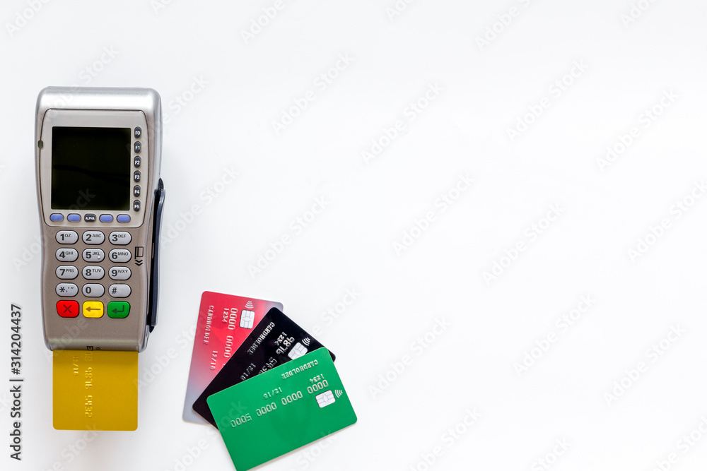 Pay by credit card in shop. Terminal and card on white background top ...