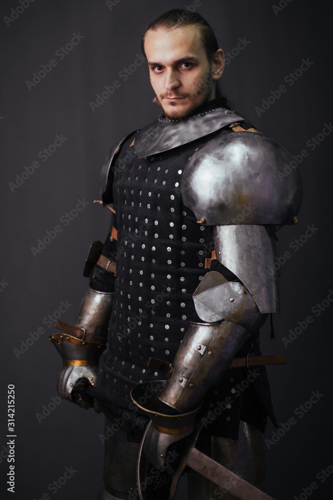 Portrait of a medieval knight with a two-handed sword. Warrior in the ...