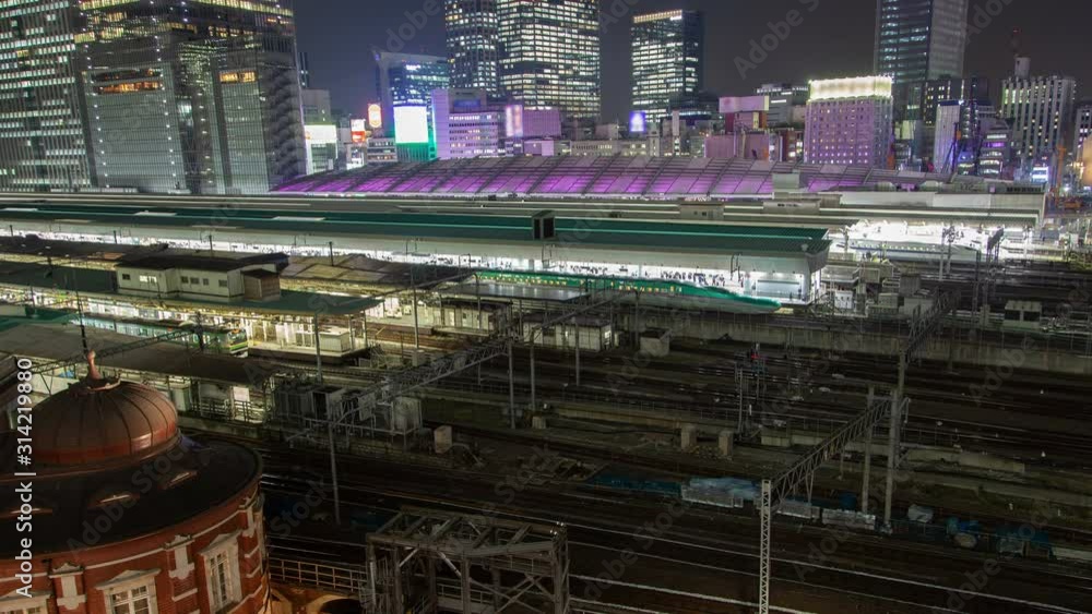 TOKYO/JAPAN - MAY 05 2019: Timelapse Tokyo Railway Station with purple ...