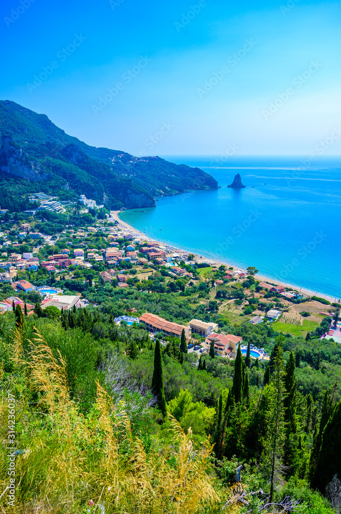 Agios Gordios Beach with crystal clear azure water and white beach in ...