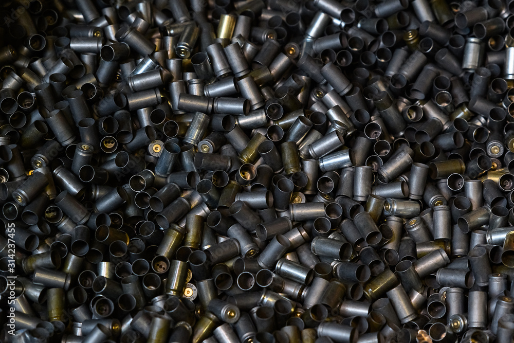 Heap of gun bullets. Weapon Cartridge case sleeve background texture ...