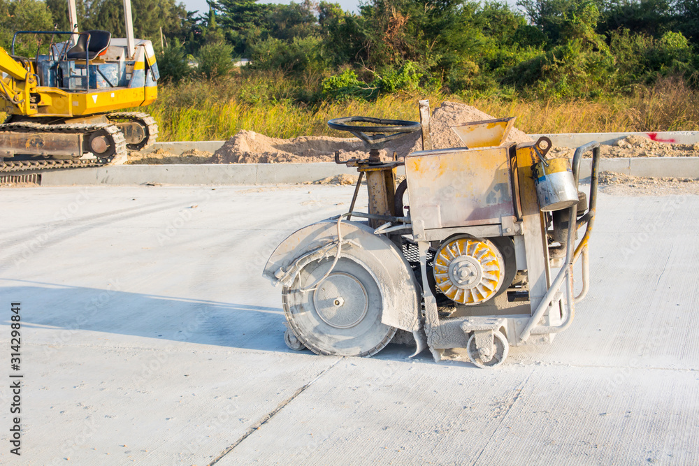 The joint cutter machine on a brushed concrete surface. Construction ...