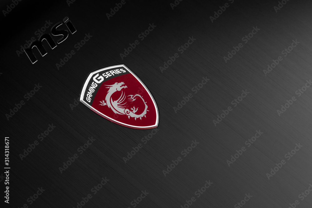 Close up of MSI logo on black polished aluminum surface with red dragon ...