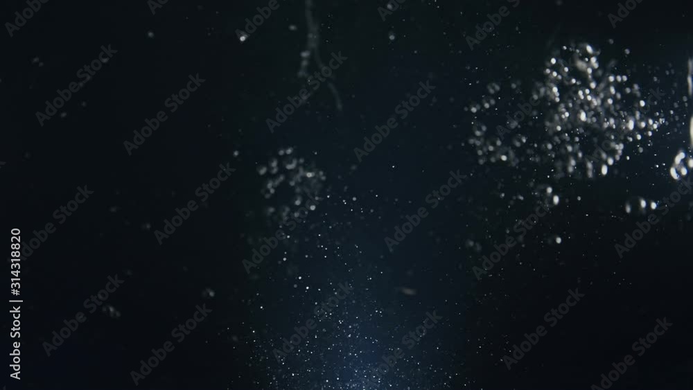 Bottom view video of underwater colorful bubbles rising to surface in ...