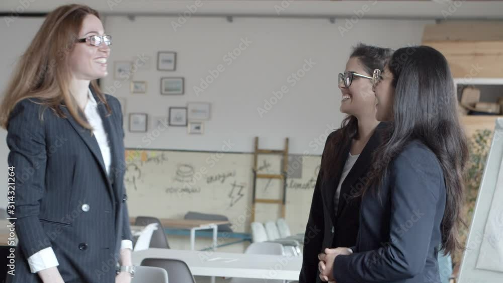 Video Stock Coworkers shaking hands and talking in office. Group of ...