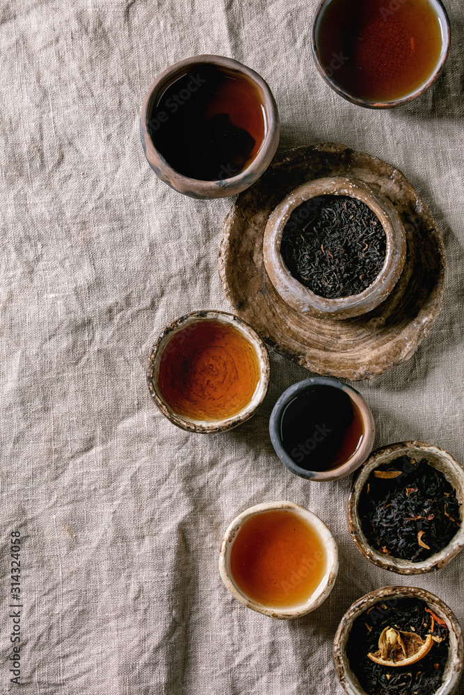 Variety of hot and dry tea green and black in traditional and wabi sabi ...