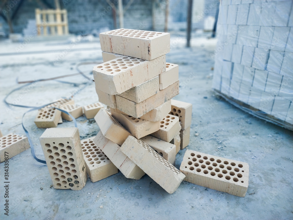 disassemble gray concrete bricks. scattered stone pavement bricks ...