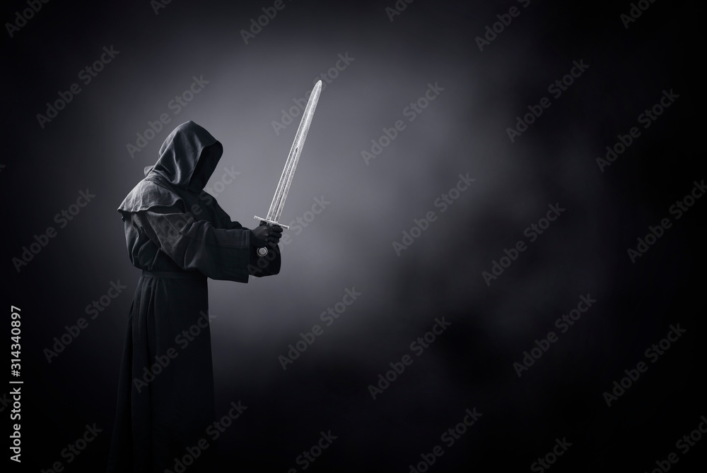 Ghostly figure with medieval sword in the dark Stock Photo | Adobe Stock