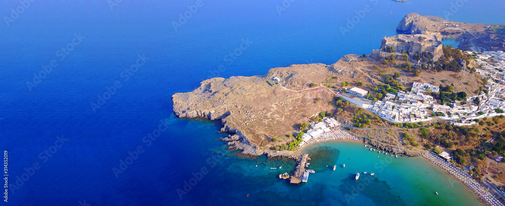 Aerial drone ultra wide photo of famous castle and village of Lindos ...