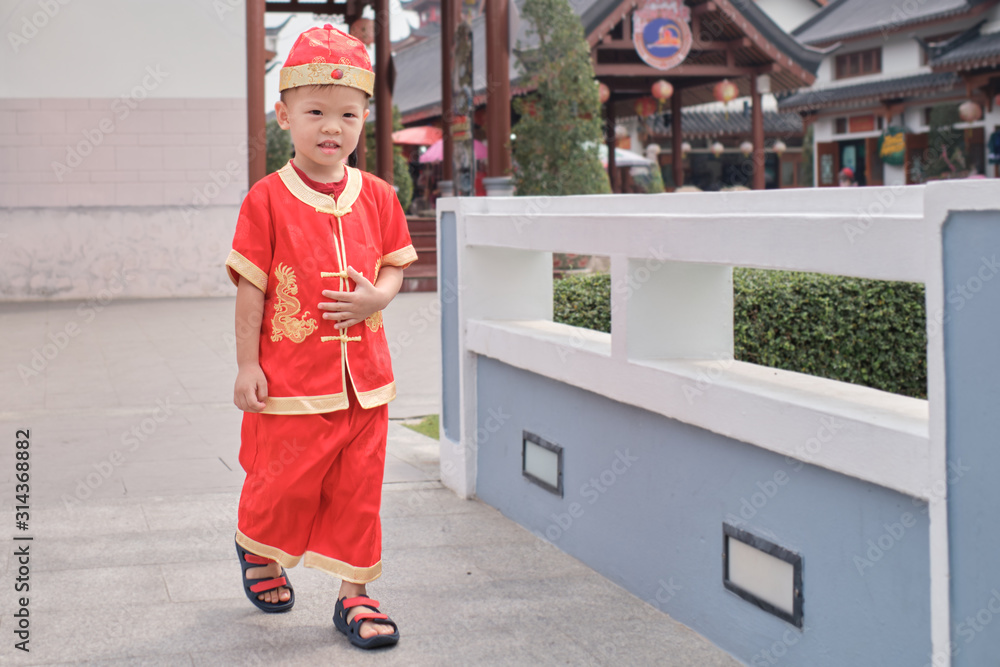 Foto de Cute little 3 years old Asian toddler boy in traditional red ...