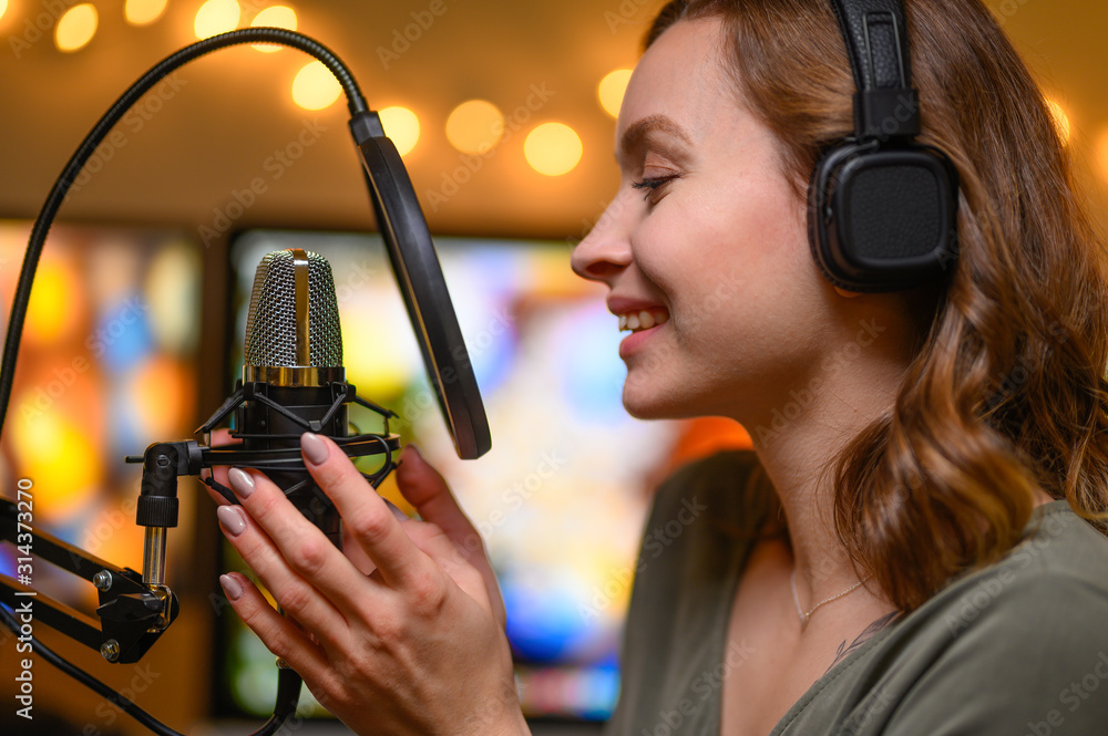 Reading text in a home studio into a microphone, radio or broadcast ...