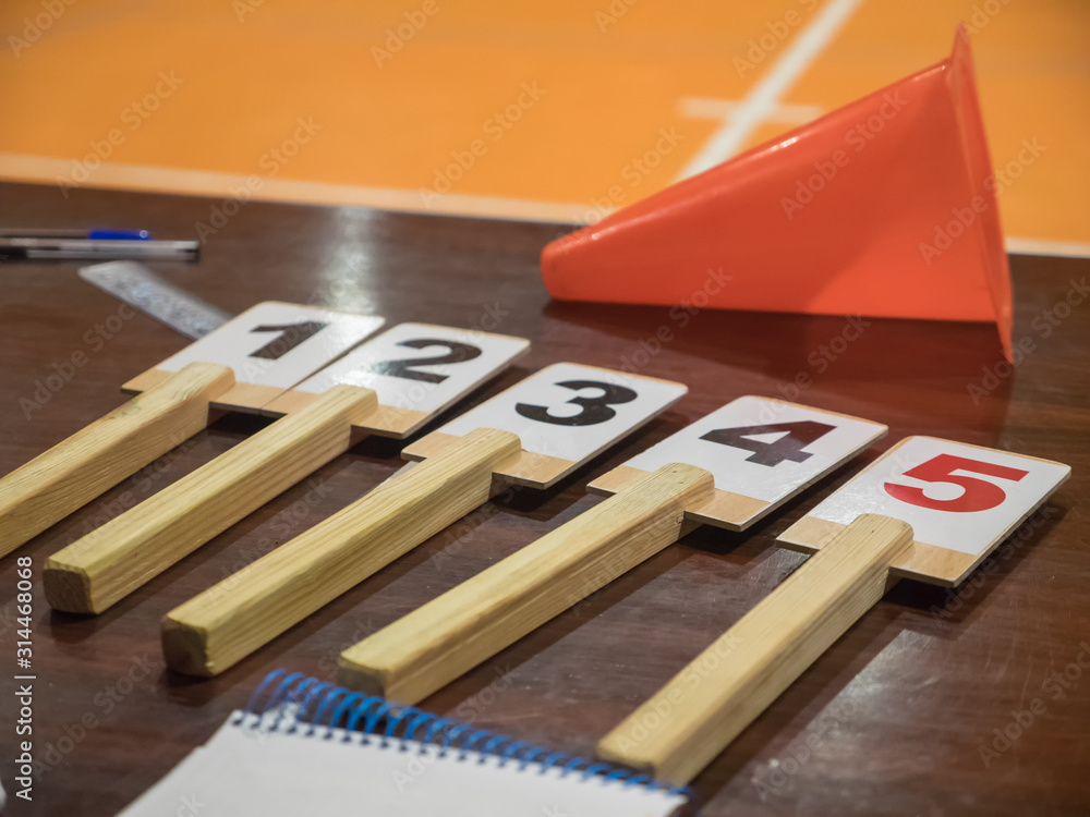 Table of a basketball game with the number of fouls, notebook, cone ...