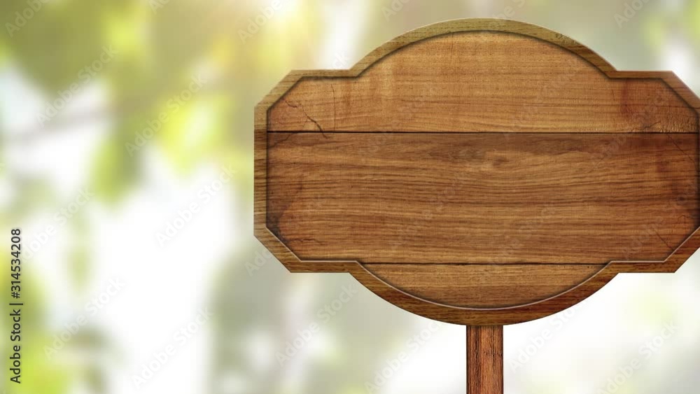 wooden sign pointer on animated background of foliage and sun glare ...
