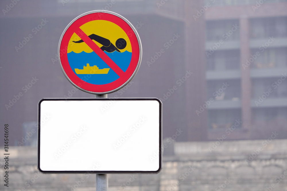 copy space, white information plate under the forbidding sign about the ...