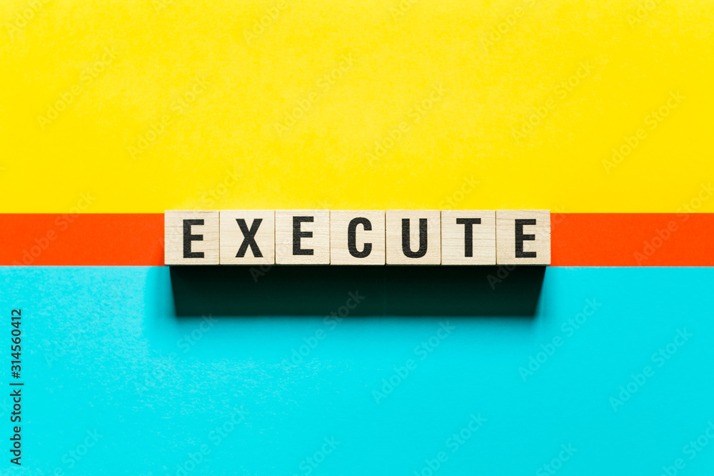 Execute word concept on cubes Stock Photo | Adobe Stock