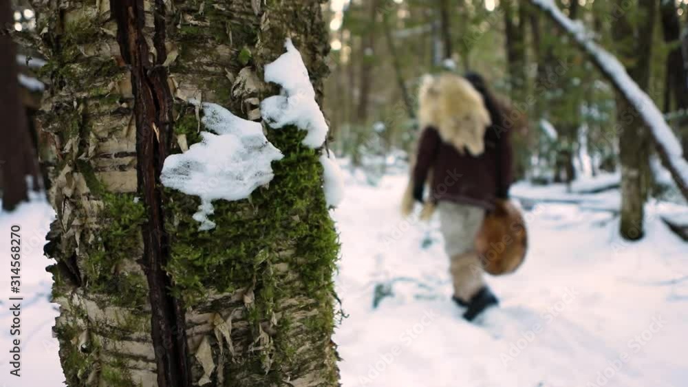 Stockvideon Selective focus footage as a native man walks through a ...