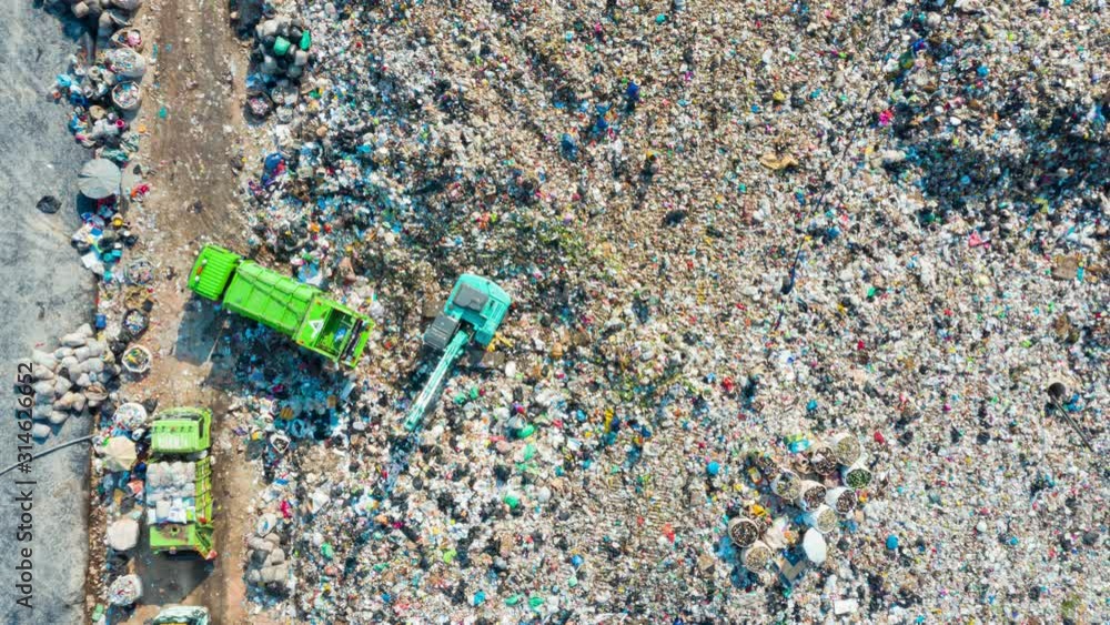 Garbage pile in trash dump or open landfill, Trash trucks dump waste ...