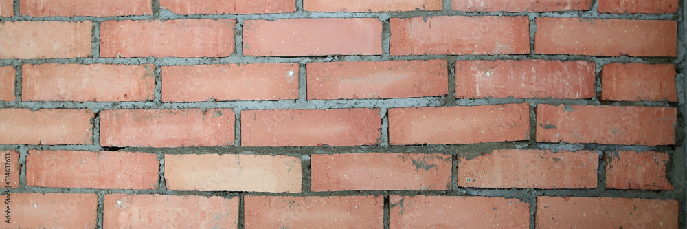 Big unfinished structure made of red blocks groomed by special ...