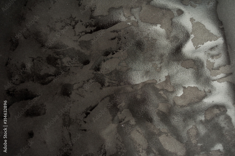 Wet black paper glued to the wall. Wet paper texture. Stock Photo ...