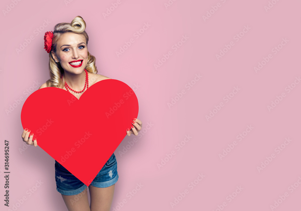 Woman holding red paper heart shape. Pin up girl. Retro fashion and ...