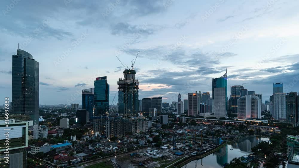 Vidéo Stock Day to night time lapse over Jakarta business district with ...