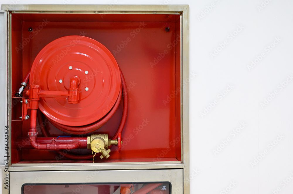 Rescue firefighter equipment, fire line in red box.Fire hose reel in ...