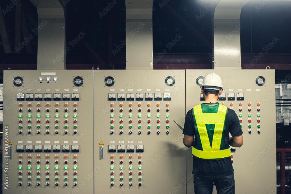 Electrical Engineer team working front control panel, Technician daily ...