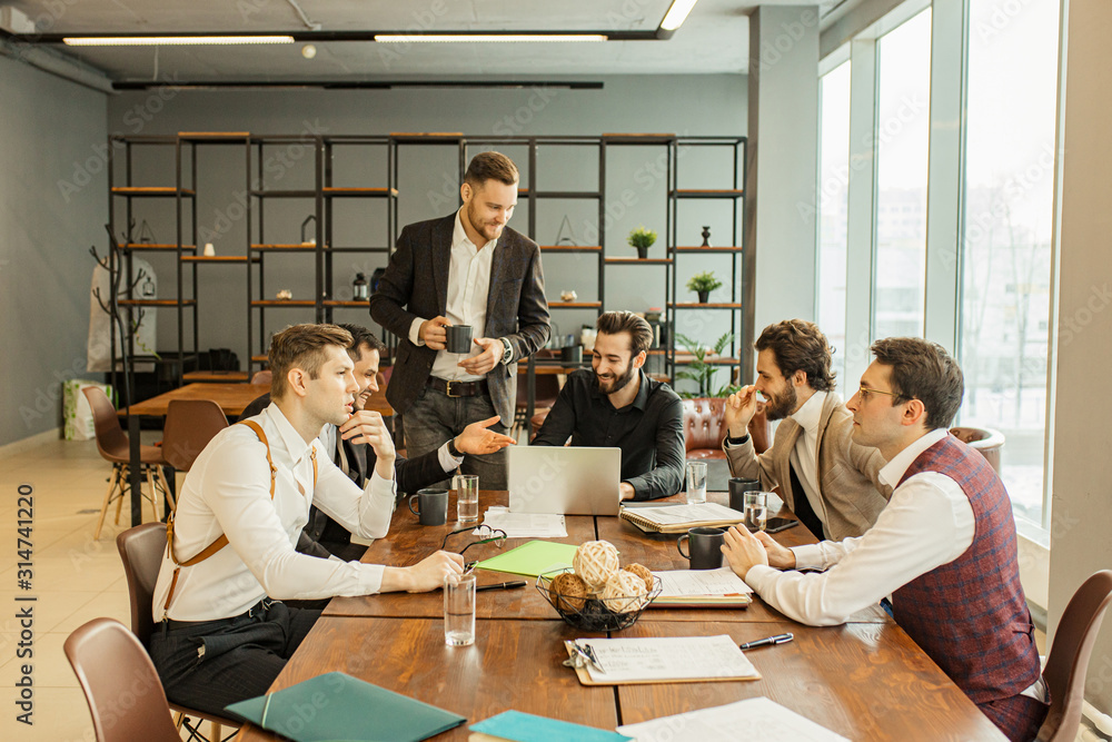 caucasian business people in formal wear sit coworking at work place ...