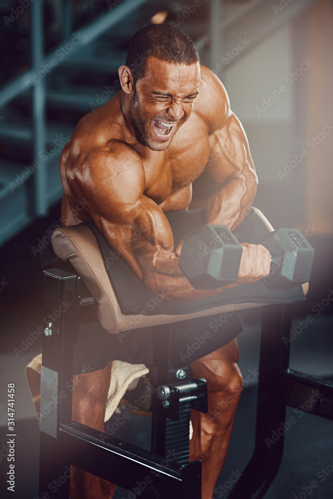 Bodybuilding Workout. Handsome Bodybuilder Training at the Gym. Copy ...