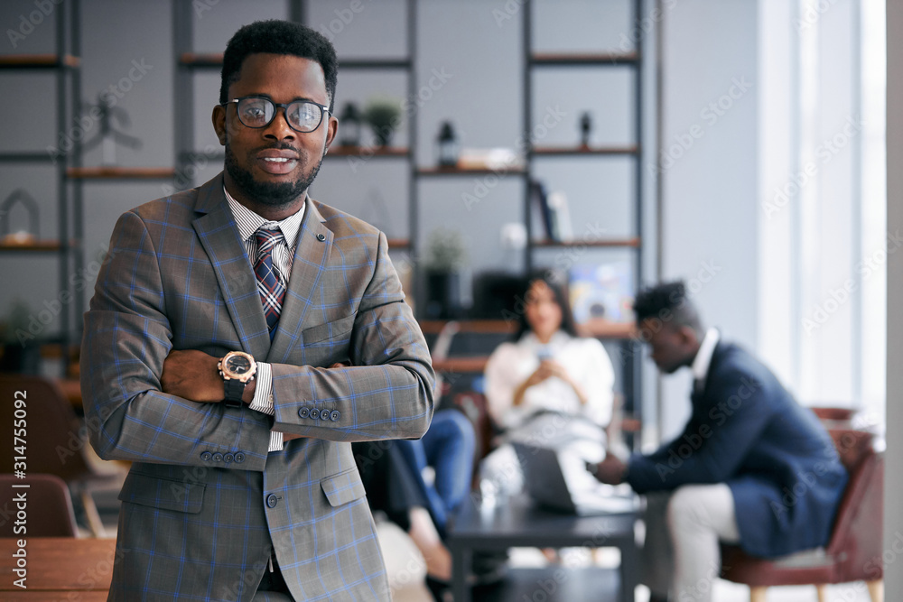 Personable man of african appearance wearing grey formal suit look at ...