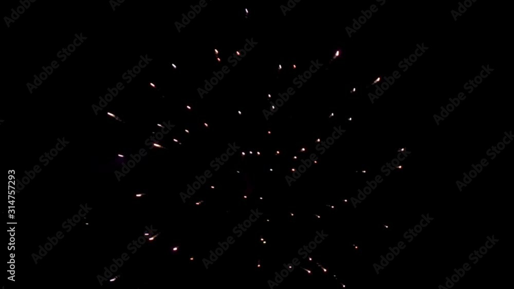 Bright fireworks explode in the dark night sky.holiday screensaver for ...