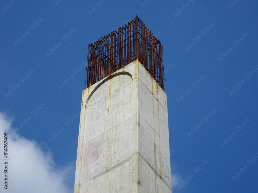 Steel reinforced concrete column under construction. It is as part of ...