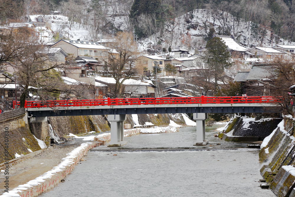 Takayama Red Bridge named Nakabashi bridge over Miya river in winter ...