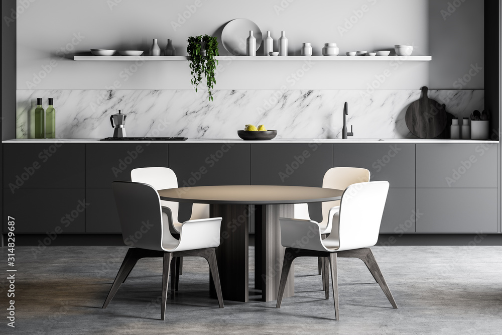 Round dining table in white marble kitchen Stock Photo | Adobe Stock