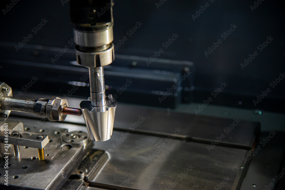 The sinker EDM machine simulate operation with the sample parts. The ...