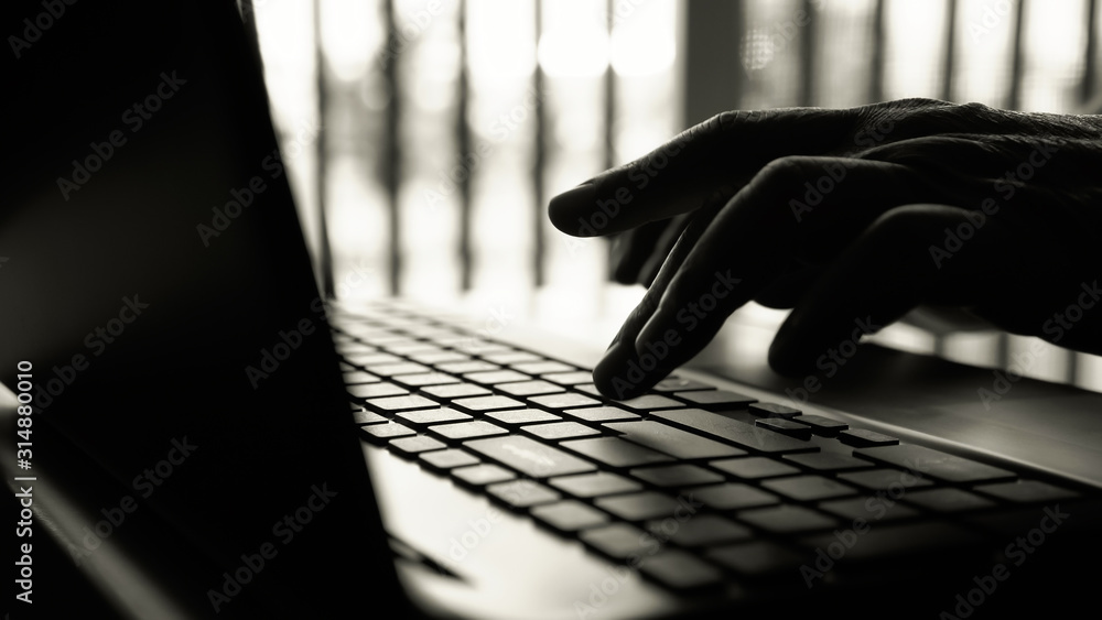 Cyber crime hand reaching out through laptop computer, attack ...