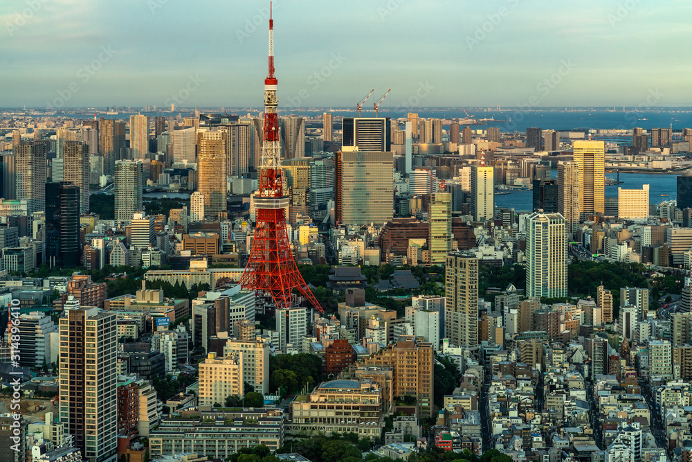 Tokyo Tower among the skyscrapers at sunset. Tokyo Tower is the most ...