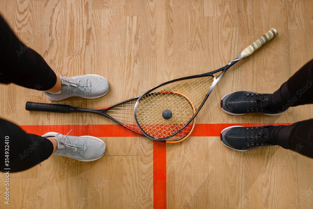 Female players legs and squash rackets, top view Stock Photo | Adobe Stock