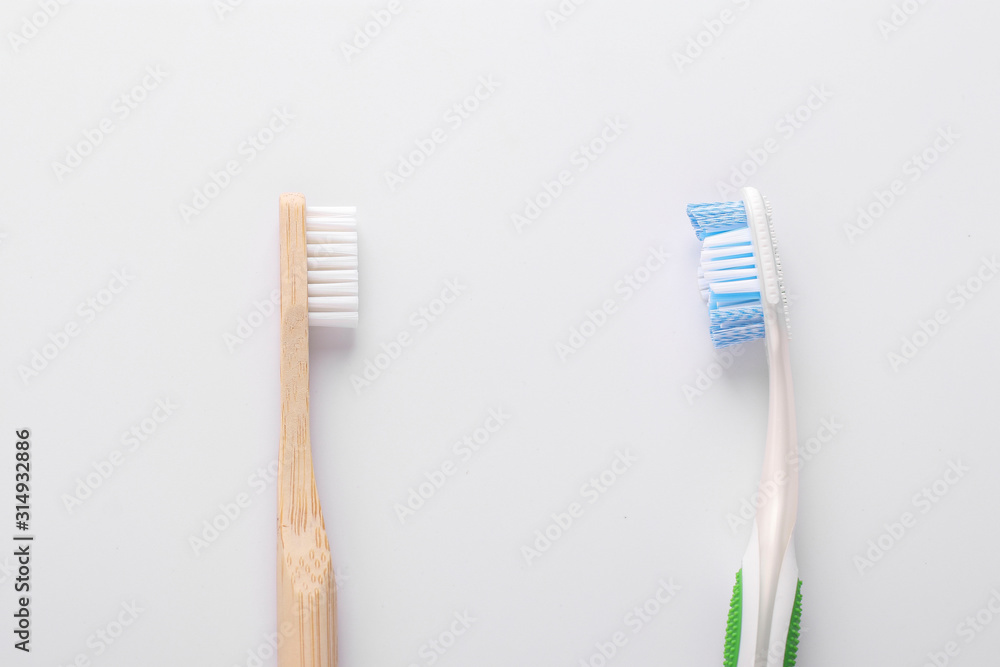 Zero waste concept, Eco wooden toothbrush vs plastic toothbrush on ...
