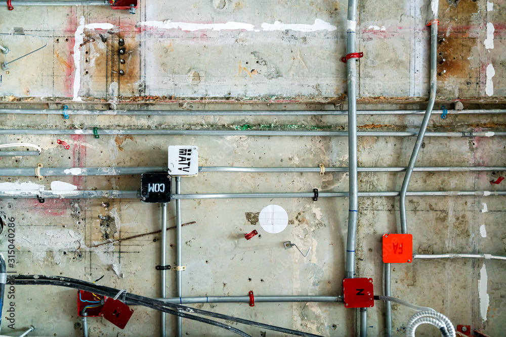 Stockfoto Electrical conduits system and metal pipeline installed on ...