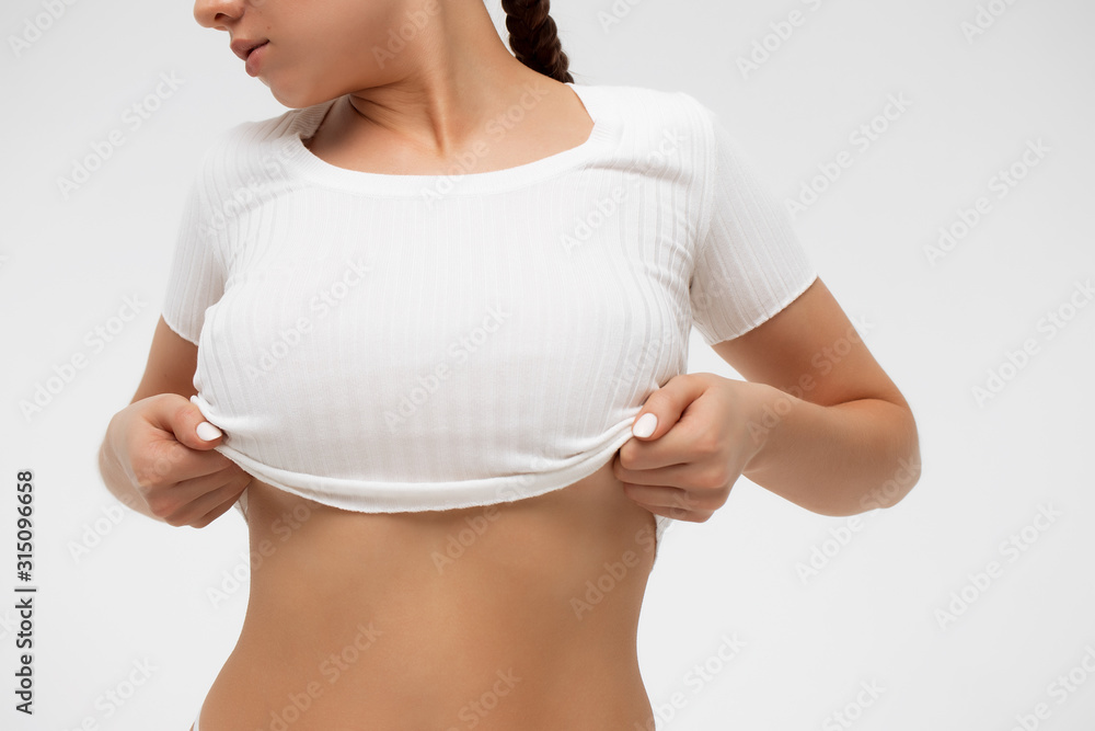 Crop Sensual Young Lady Taking Off Shirt Stock Photo Adobe Stock