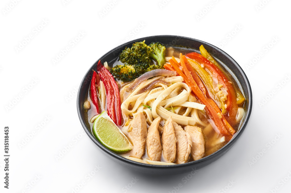 Chicken Thukpa in black bowl isolated at white background. Chicken ...