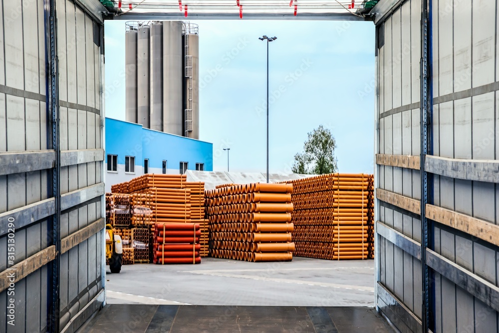 Loading the Truck. Forklift loading a Trailer . Unloading big container ...