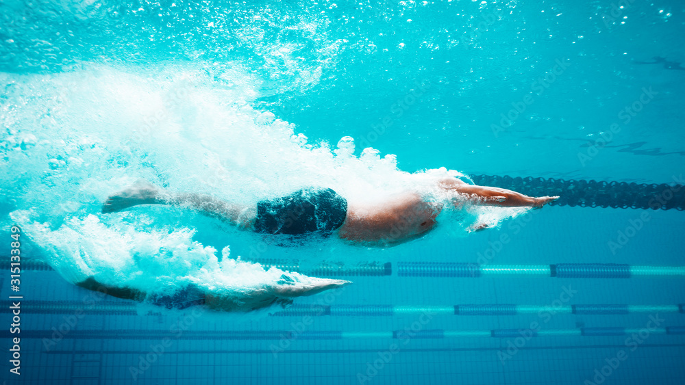 Swimmers racing in pool Stock Photo | Adobe Stock