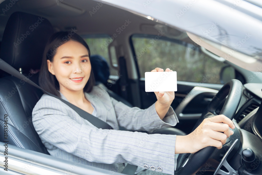 Chinese Thai Asian Woman showing her blank driving license while in the ...