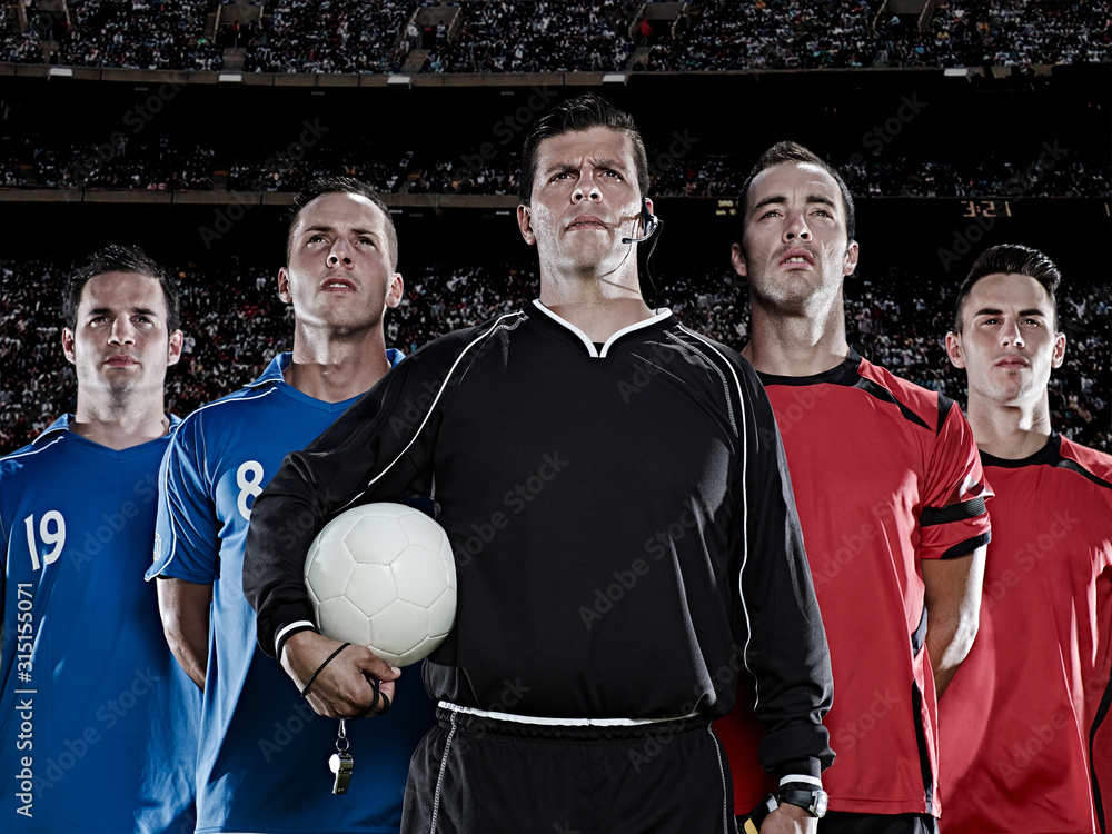 Soccer teams and referee standing in stadium Stock Photo | Adobe Stock