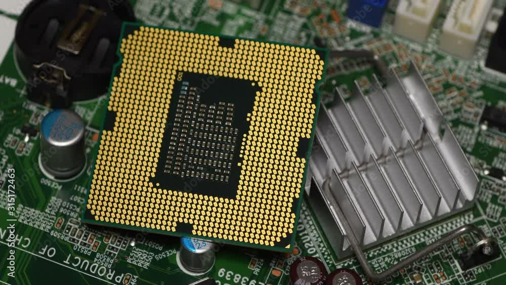 Detail of Computer CPU Chip and CPU socket over PC Motherboard. 4K UHD ...