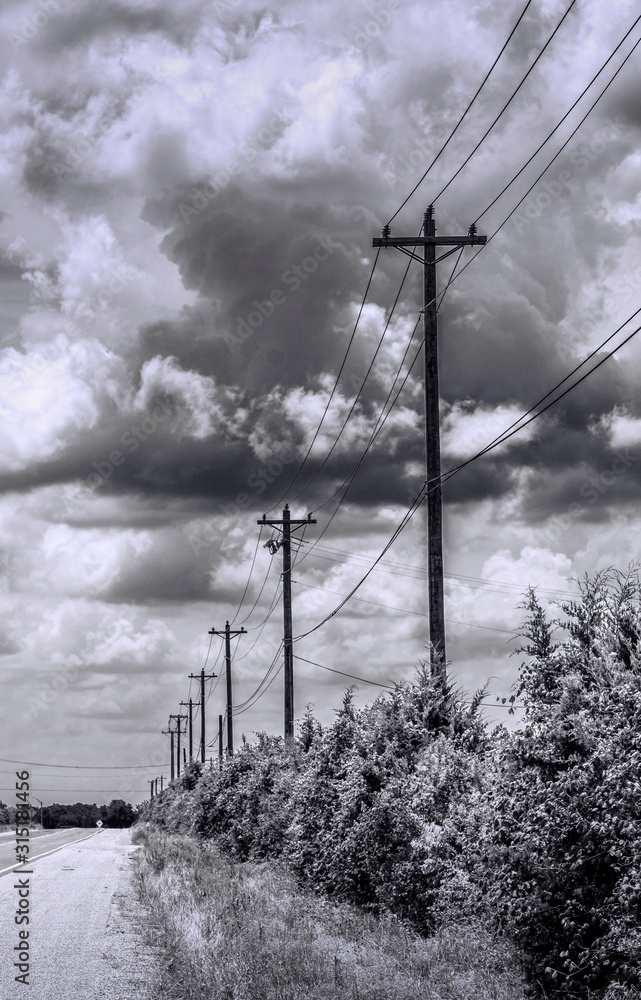 Line of electric power poles and wire along Texas highway Stock Photo ...