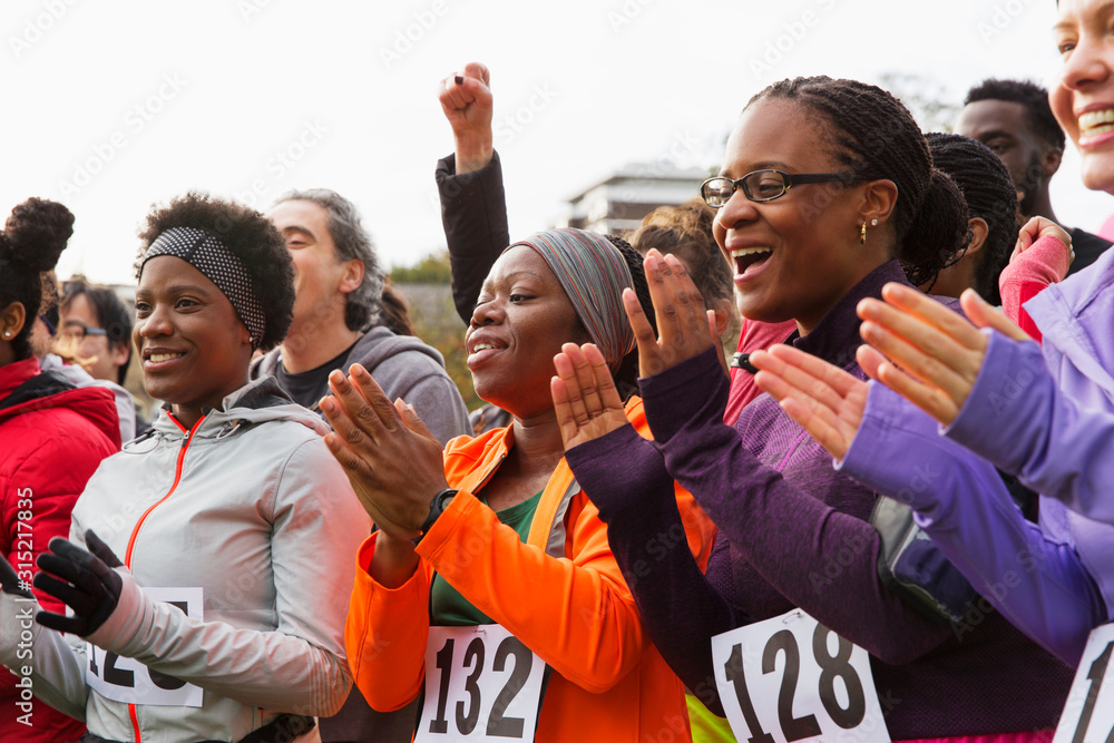 Marathon runners clapping, cheering Stock Photo | Adobe Stock